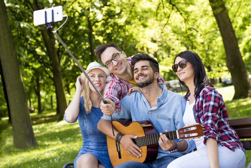 Sunny Scenery of a Group of Young Friend Having Fun in a Park Stock ...