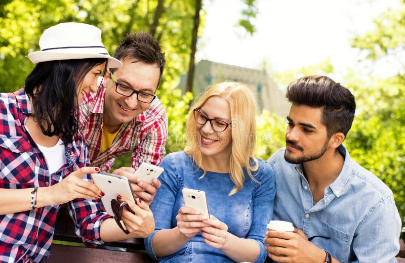 Sunny Scenery of a Group of Young Friends Having Fun in a Park Stock ...