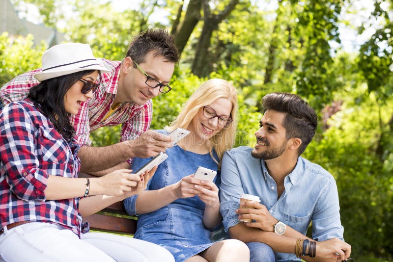 Sunny Scenery of a Group of Young Friends Having Fun in a Park Stock ...