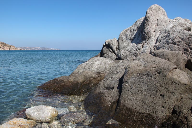 Sunny Scenery of a Rocky Beach with Big Grey Rocks Stock Image - Image ...
