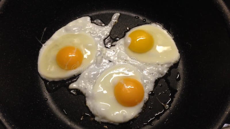 Sunny-side Up Eggs Frying in Pan Stock Video - Video of eggs, stovetop: 348242847