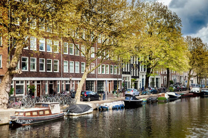 Sunny Spring Day in Amsterdam. Canal View with Boats and Bicycles ...