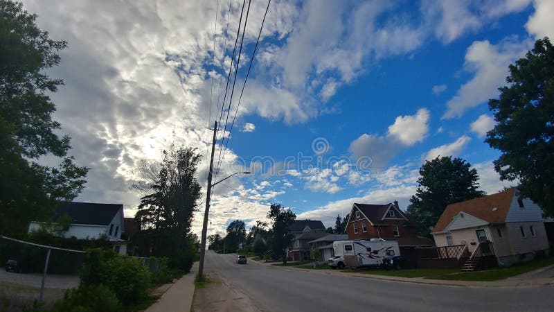 Sunny street editorial photo. Image of clouds, street - 95104761