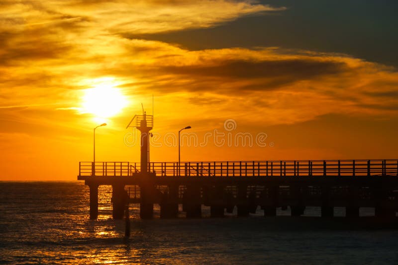 Sunny Sunset through Pier at the Sea Stock Image - Image of beacon ...