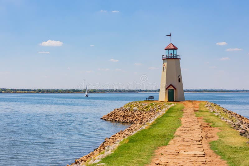 Sunny View of the Lake Hefner Lighthouse with a Sailing Boat Stock ...