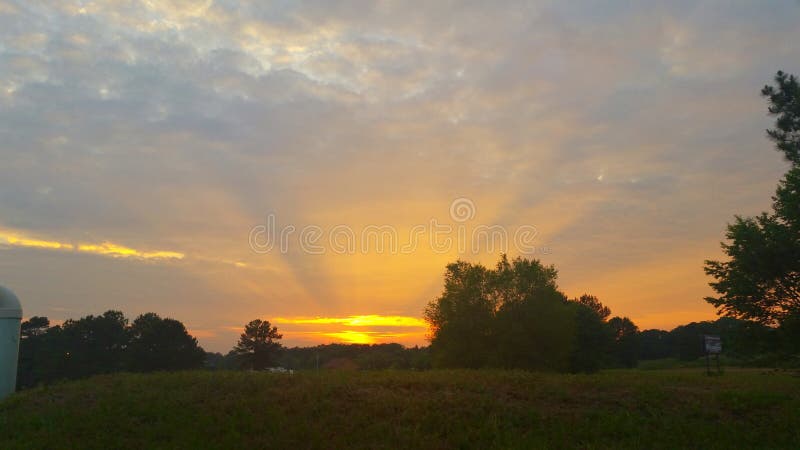 Sunray stock image. Image of orange, sunray, sunset, cloud - 98204245