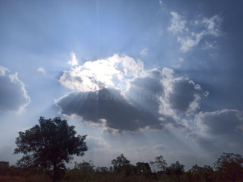 Sunrays in the noon stock photo. Image of clouds, sunlight - 197765414