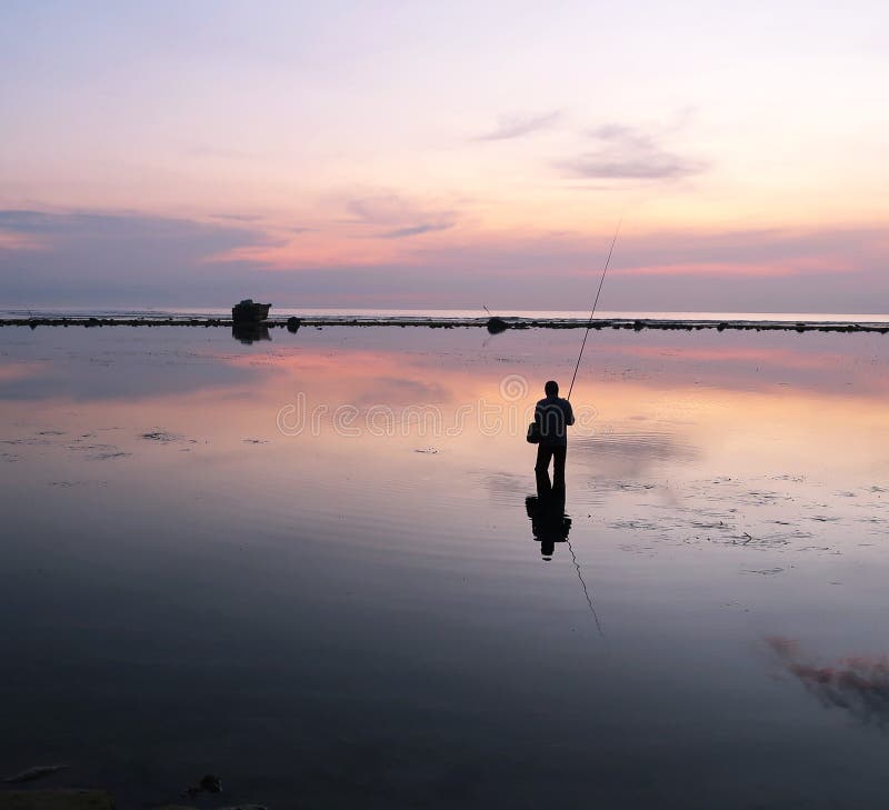 Sunrise and Angler, Good Morning from Sanur Beach Stock Photo - Image ...