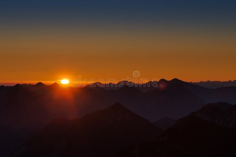 Sunrise in Austrian Mountains with Glowing Sun Stock Image - Image of ...