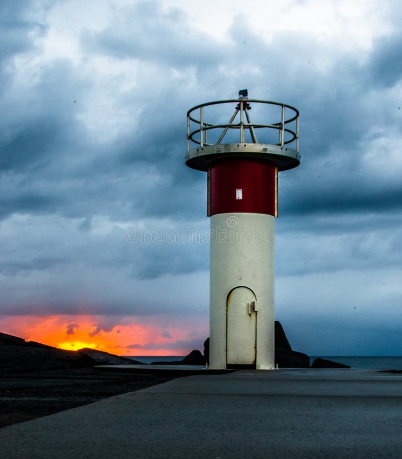 Sunrise and beacon stock image. Image of point, bright - 141458979