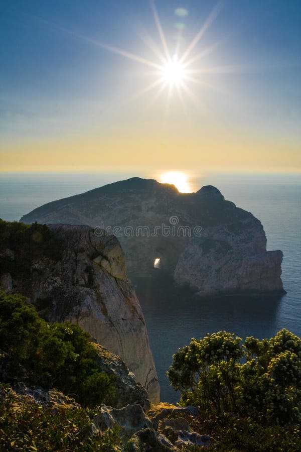 Sunrise Behind the Cliff with the Hole. Stock Image - Image of italy ...