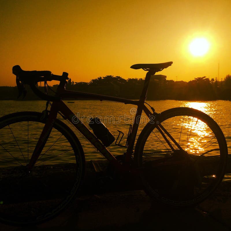 Sunrise with bicycle stock photo. Image of sunrise, bicycle - 59285924