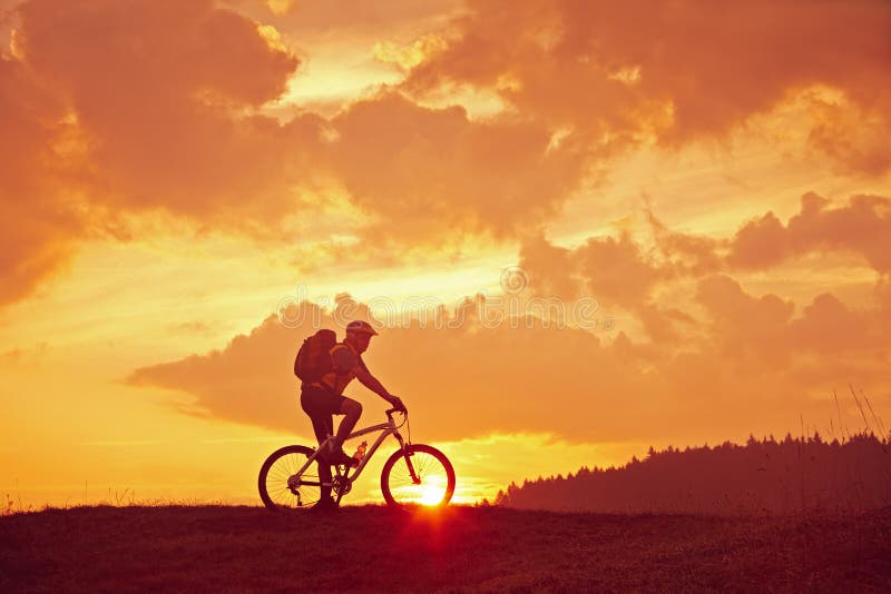 Sunrise with biker stock photo. Image of silhouette, sunrise - 53733710