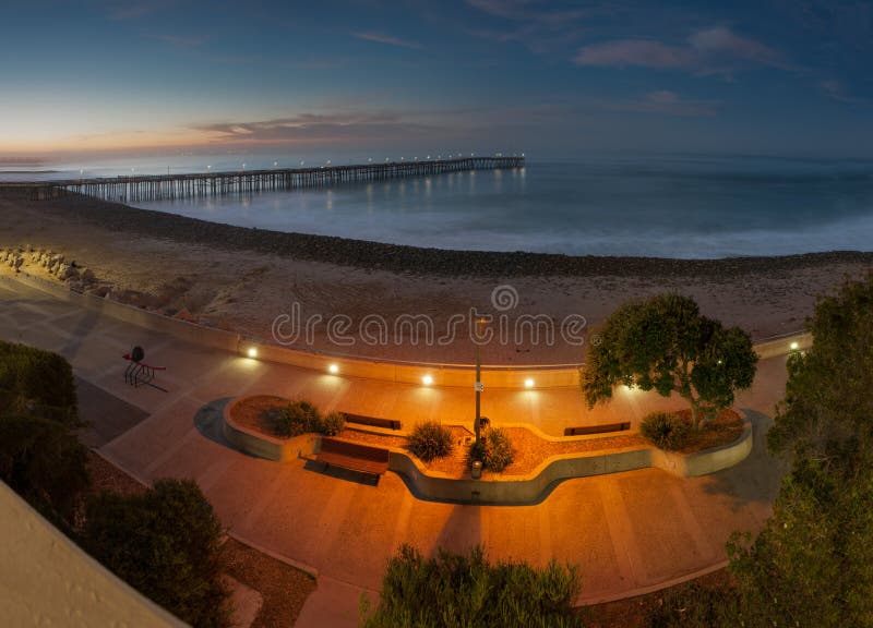 Sunrise and Boardwalk Lights Illuminate the Path Stock Photo - Image of ...