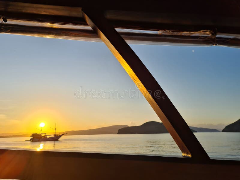 Sunrise and boat stock image. Image of beach, evening - 4232195