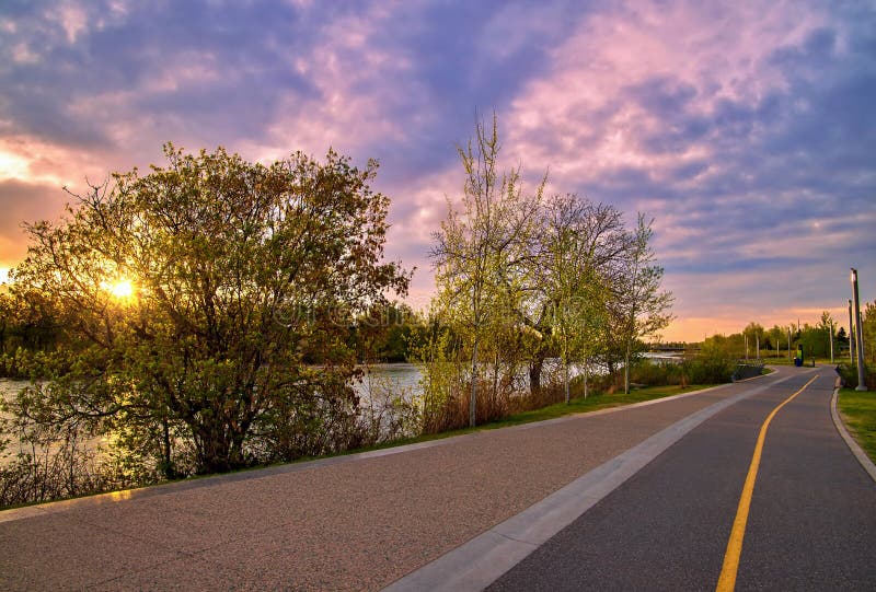 Sunrise Clouds Over the Bow River Pathway Stock Image - Image of trees ...