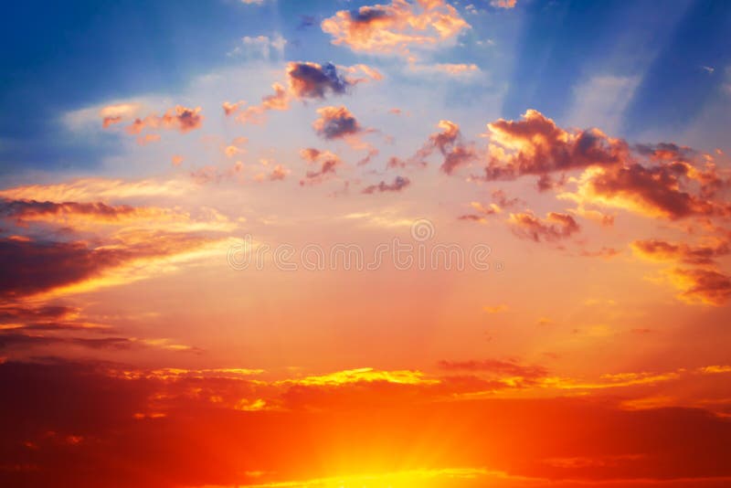 Sunrise Dramatic Blue Sky with Orange Sun Rays Breaking through the ...