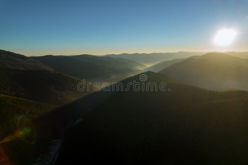 Sunrise and Fog Over the Forest. Sun Rays Over a Coniferous Forest ...