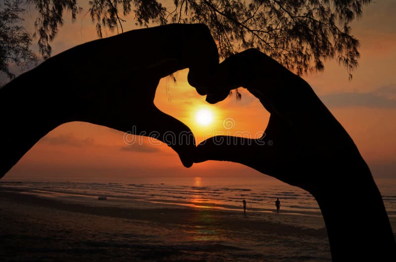 Sunrise in Hand Heart Frame on Beach View. Stock Image - Image of ...