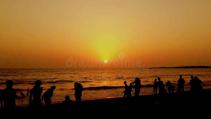 Sunrise at Juhu beach stock photo. Image of horizon - 219502144