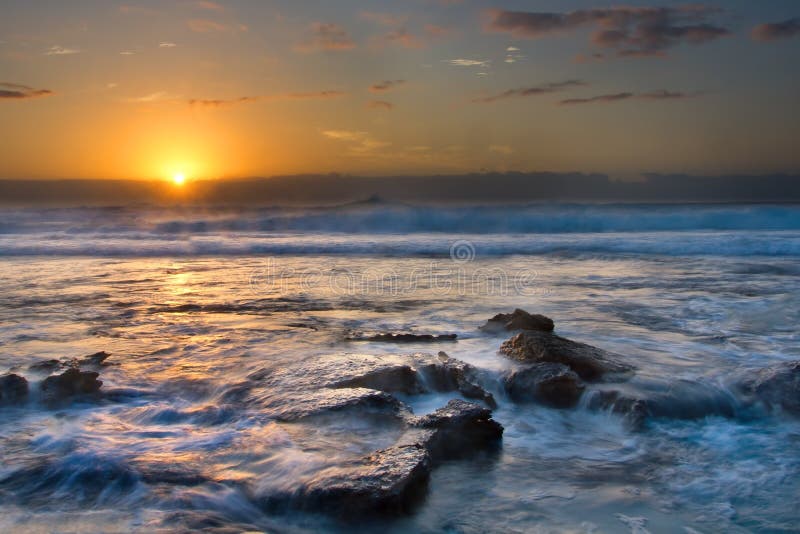 Sunrise Landscape of Ocean with Waves Clouds and Rocks Stock Photo ...