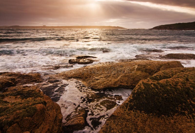 Sunrise Landscape of Ocean with Waves Clouds and Rocks Stock Photo ...