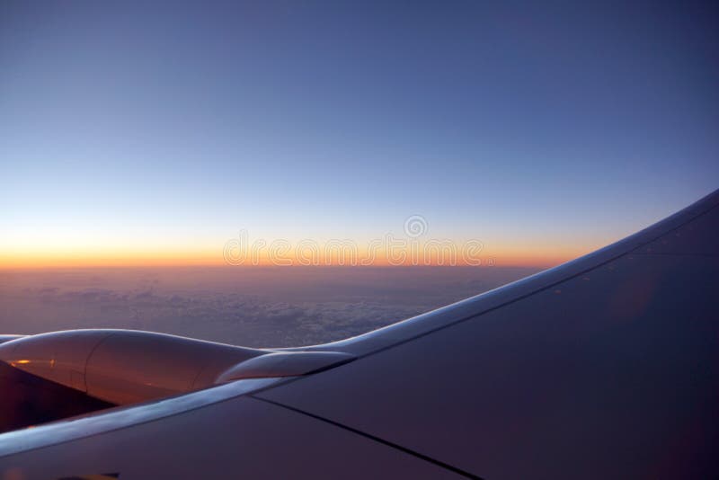 Sunrise Light Over the World Full of Clouds with Airplane Jet Wing ...