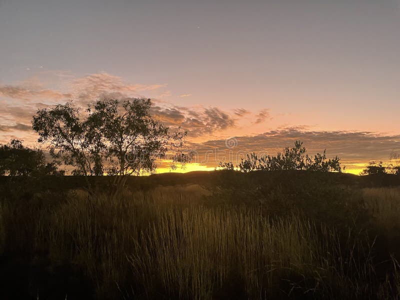 A sunrise in a mining camp stock photo. Image of western - 248803708