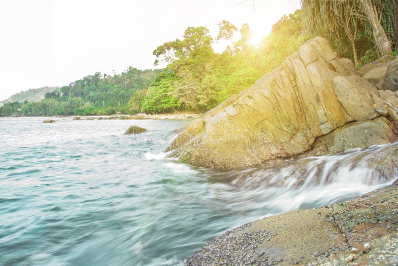 Sunrise in Morning and Flare Rock on the Beach Stock Photo - Image of ...