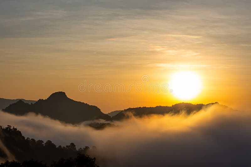 Sunrise and Morning Light Behind the Mountains with the Mist Covered ...