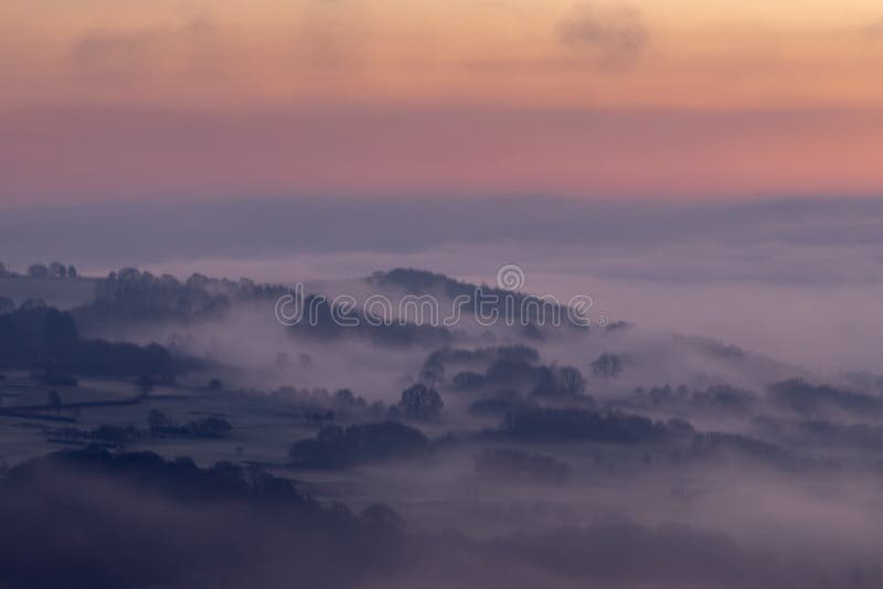 Sunrise with morning mist stock image. Image of rise - 203789565
