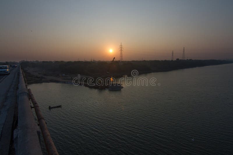 Sunrise Near a River and Bridge Stock Image - Image of sunrise ...