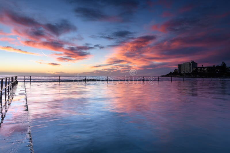 Sunrise by the ocean pool stock image. Image of blue - 113299655