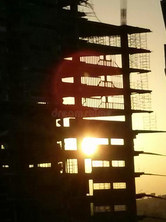 Sunrise over construction editorial image. Image of sunrise - 74614575
