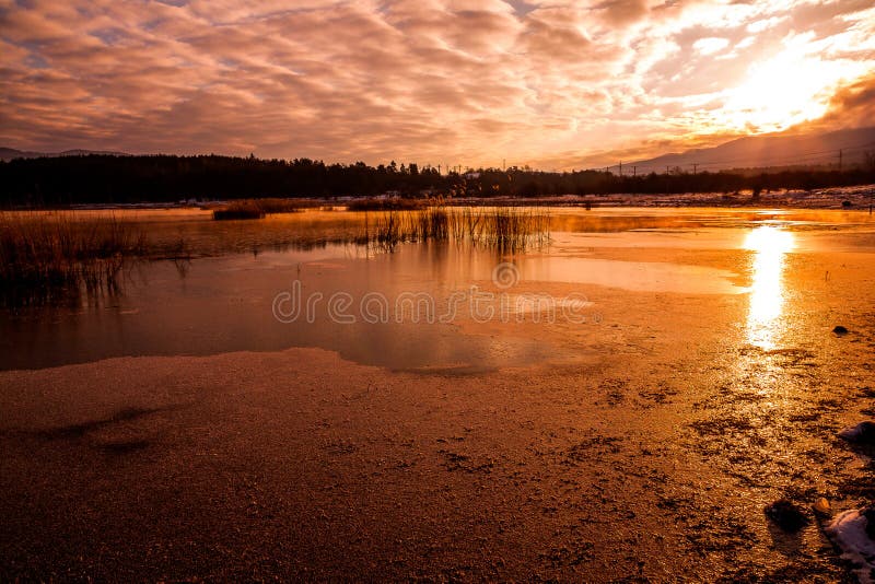 Sunrise over a dam stock photo. Image of beautiful, landscapes - 140460694