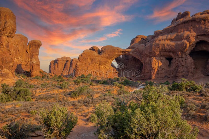 Sunrise Over the Double Arch in the Windows Section of Arches National ...
