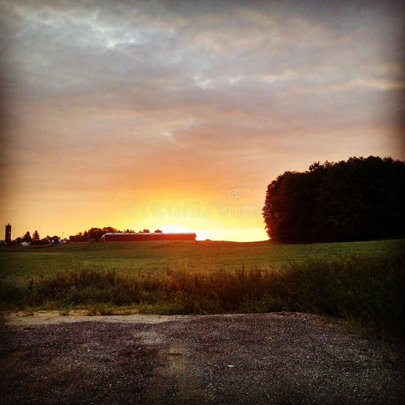 Sunrise over farm stock photo. Image of barn, farm, field - 64373704