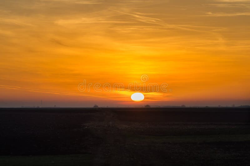 Sunrise over a field stock image. Image of autumn, peaceful - 62600605