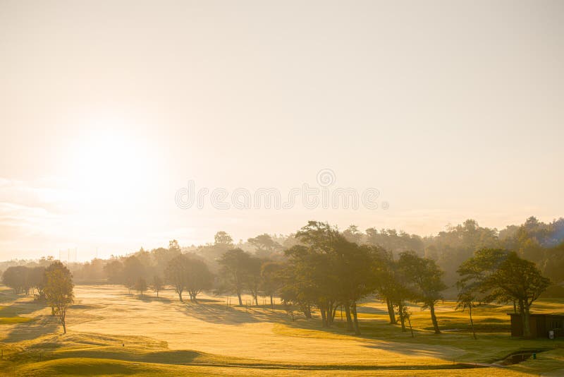 Sunrise over a golf course stock image. Image of equipment - 185252171
