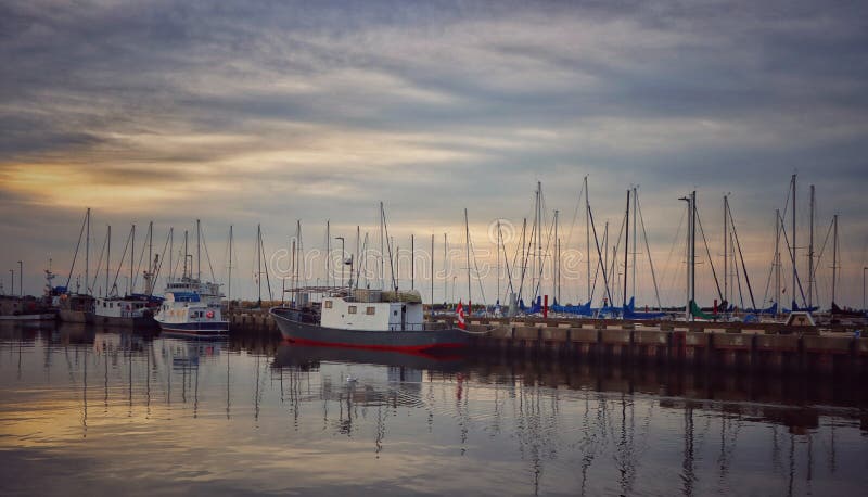 Sunrise over the harbour stock photo. Image of water - 195700308