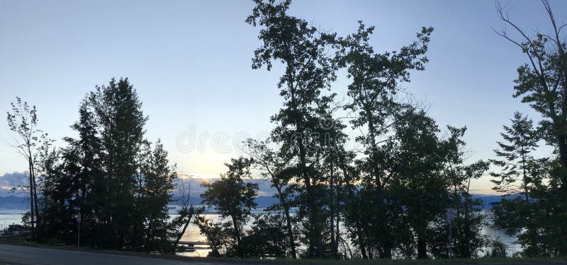 Sunrise Over the Lake Behind the Trees Stock Photo - Image of handiwork ...