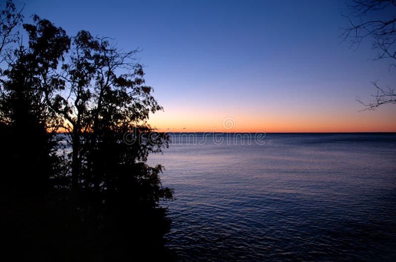 Sunrise over Lake Superior stock image. Image of trees - 203931
