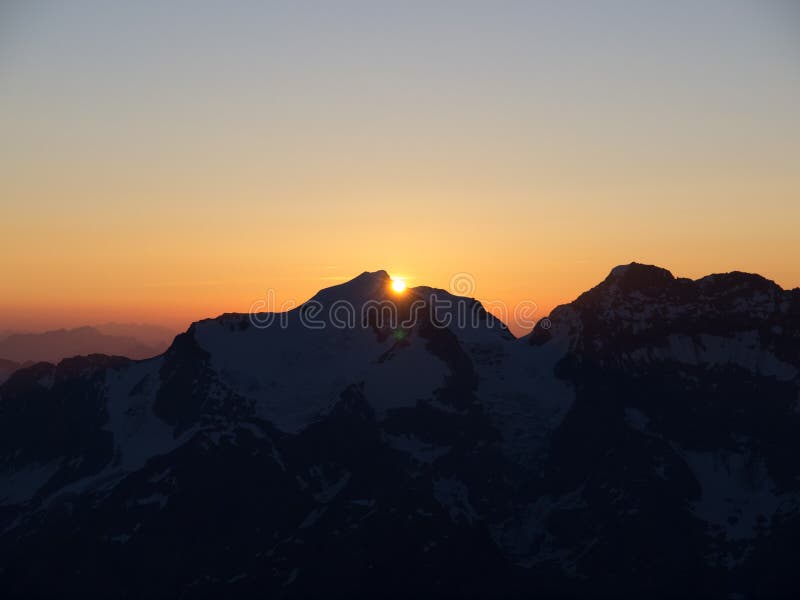 Sunrise Over Mountain Summit Stock Photo - Image of freezing, swiss ...