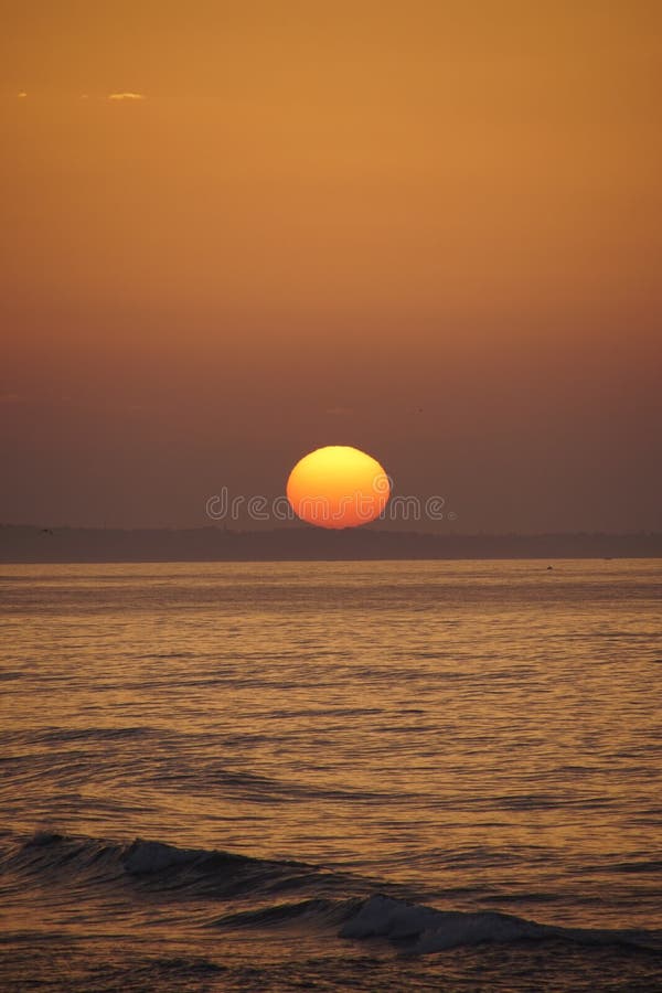 Sunrise Over the Ocean. Atlantic. Early Morning. Black Rocks. Horizon ...