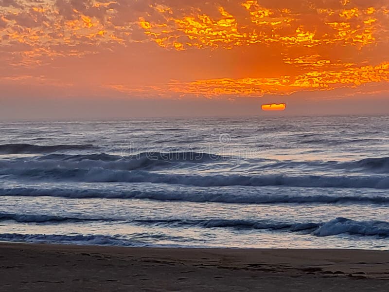 Sunrise Over Ocean with Clouds and Blue Sky Stock Image - Image of ...