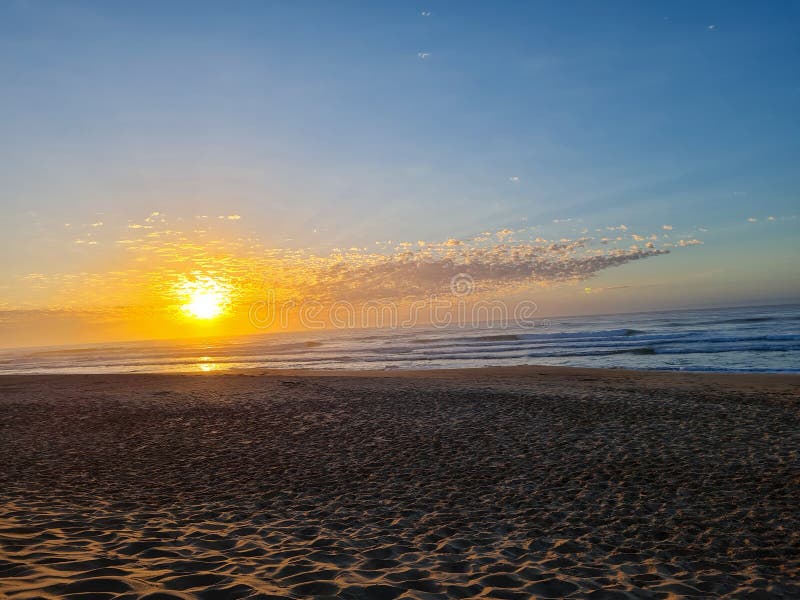 Sunrise Over Ocean with Clouds and Blue Sky Stock Photo - Image of blue ...