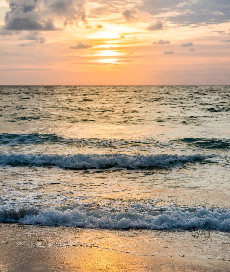 Sunrise over ocean surf stock photo. Image of morning - 120264394