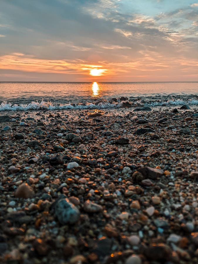 Sunrise Over the Pebbles of a Cape Cod Beach in Massachusetts. Stock ...