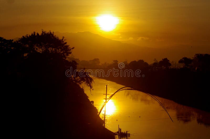 Sunrise over river in Java stock photo. Image of travel - 44324440