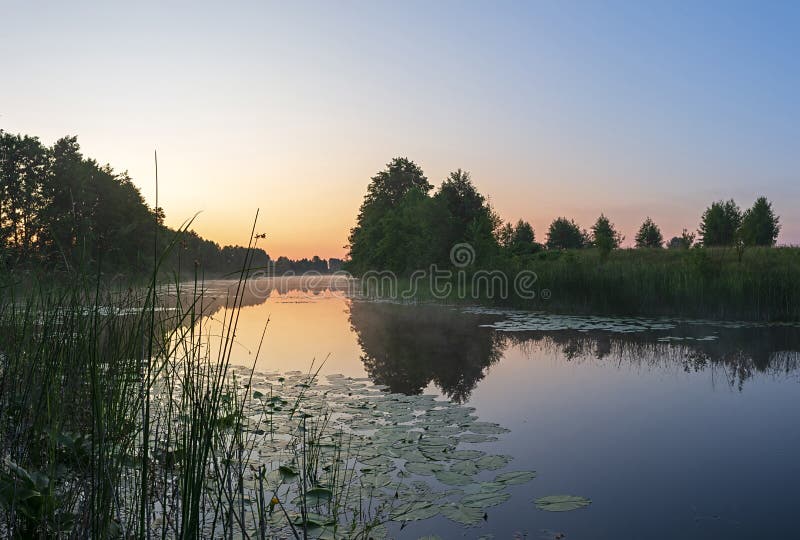 Sunrise over the river stock photo. Image of reflection - 239932110